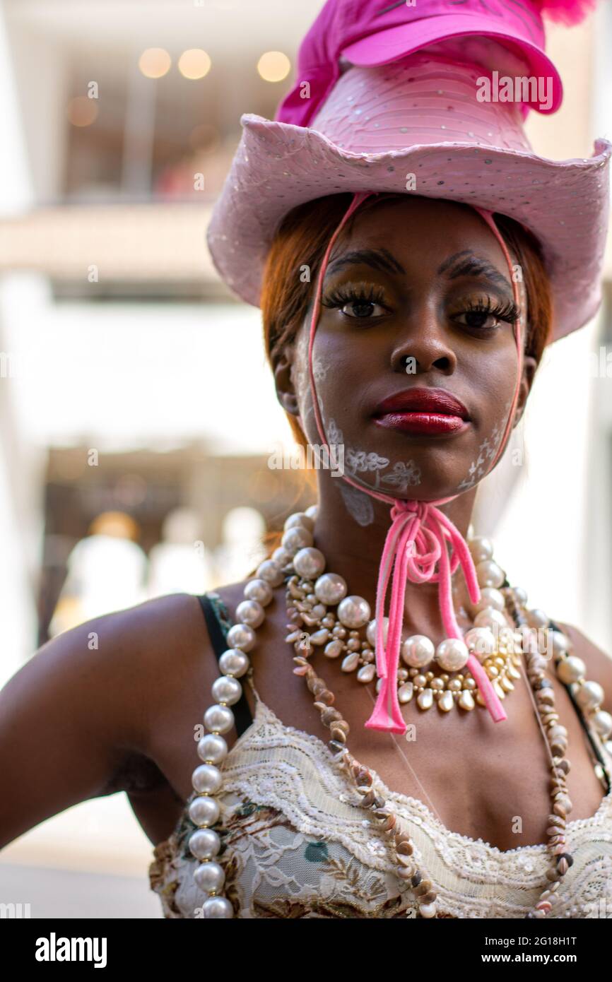 A model showcases Pierre Garroudi's latest colourful collection at one ...