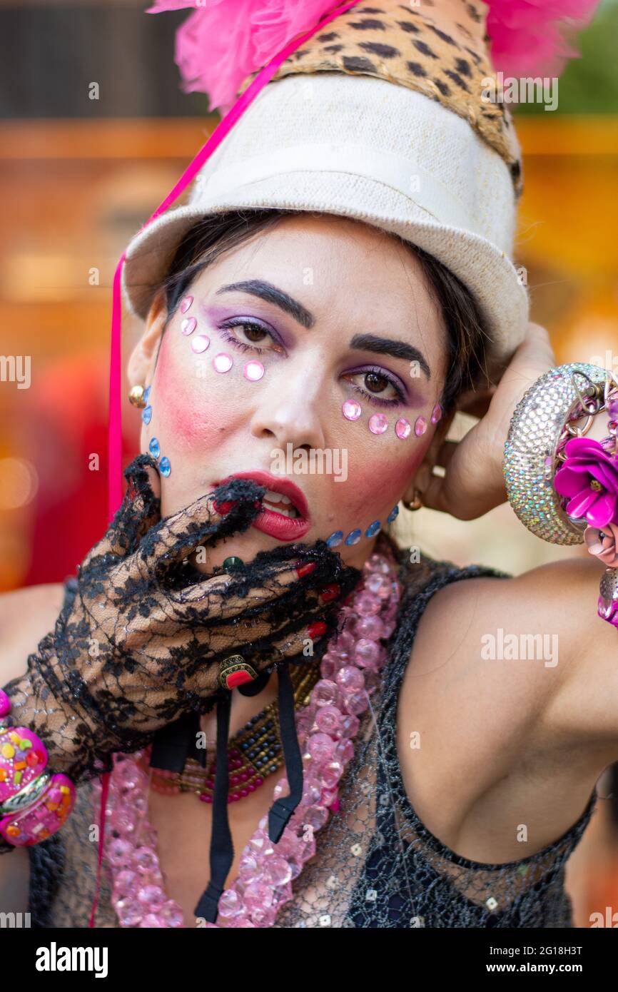 A model showcases Pierre Garroudi's latest colourful collection at one ...