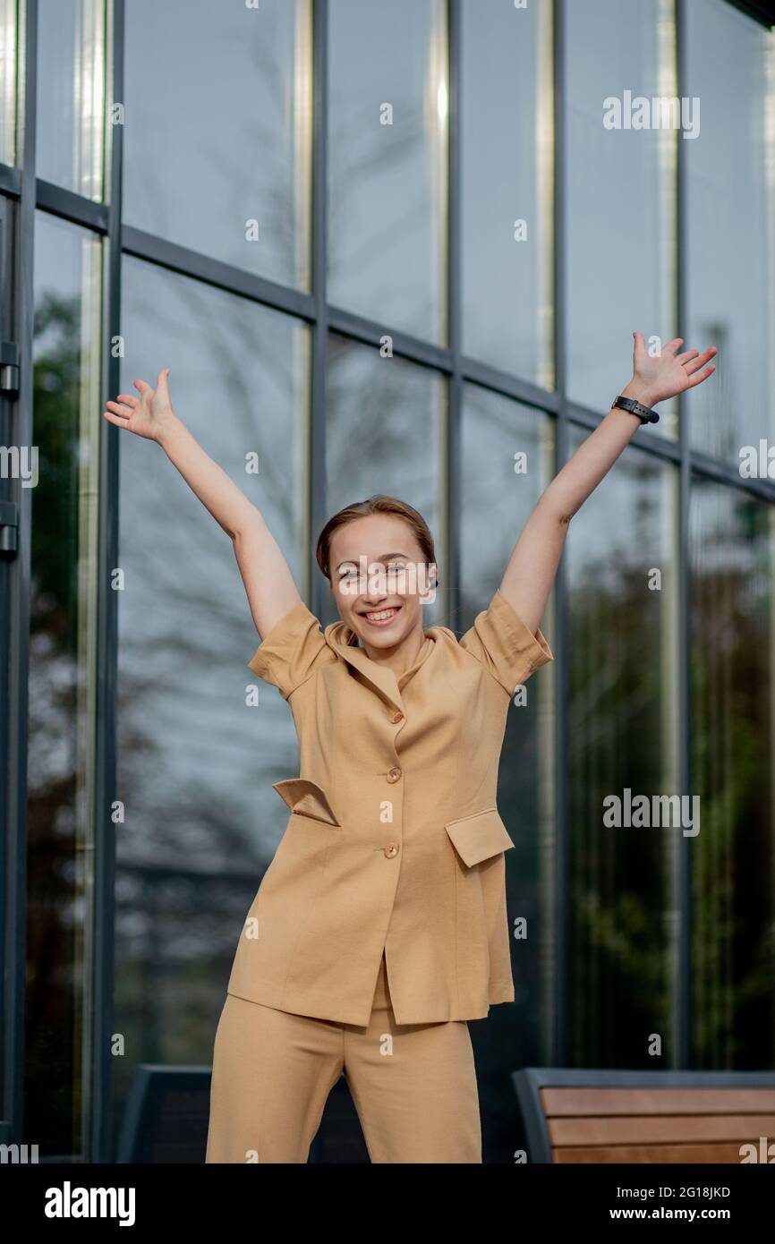 Business success - Happy young business woman celebrating work career ...