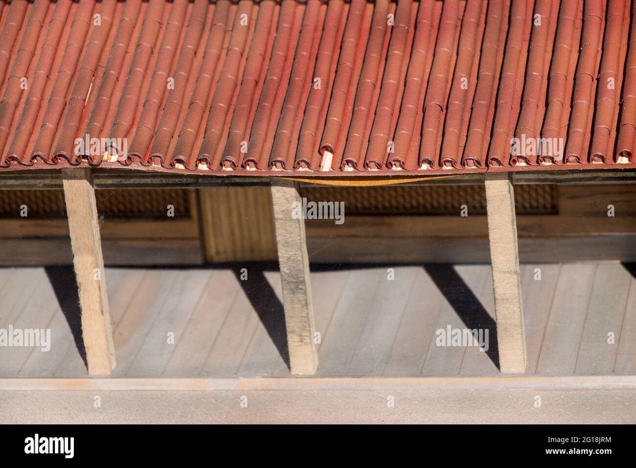 Red cover on the roof of an old building Stock Photo - Alamy