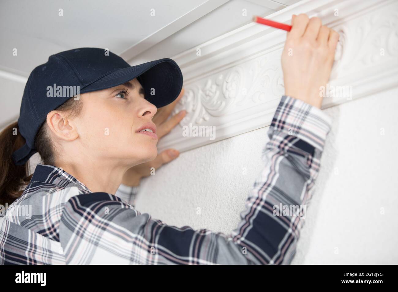 female worker with corner and pencil Stock Photo - Alamy