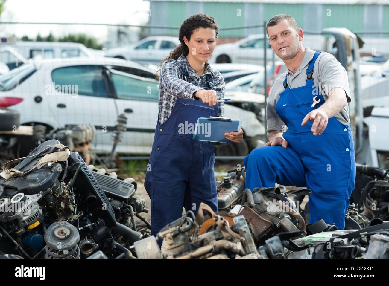 mechanics sorting out vehicle parts that can be reuse Stock Photo - Alamy