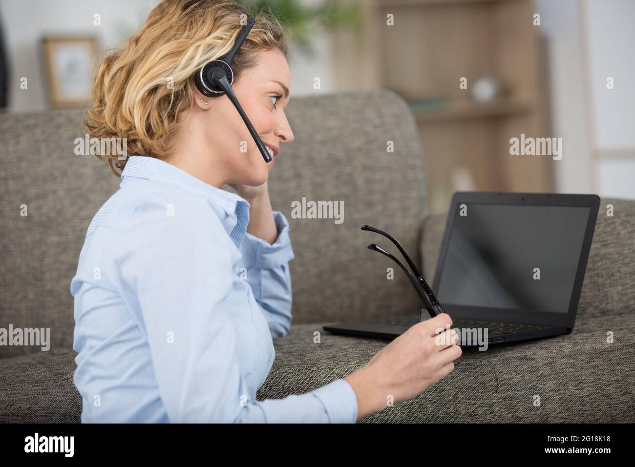 young blonde call center operator woman at workplace Stock Photo - Alamy