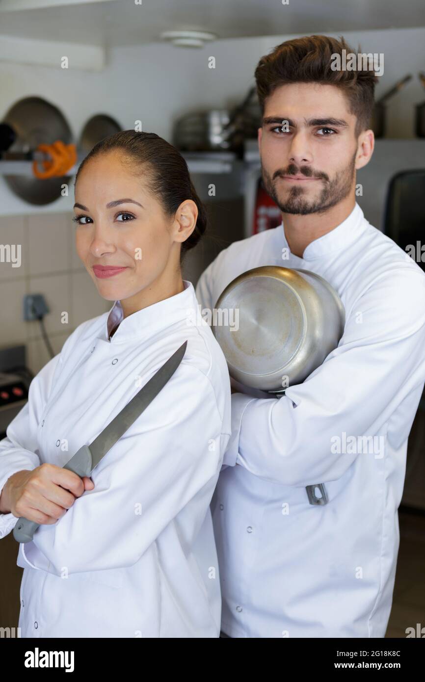 couple of cooks in the kitchen Stock Photo - Alamy