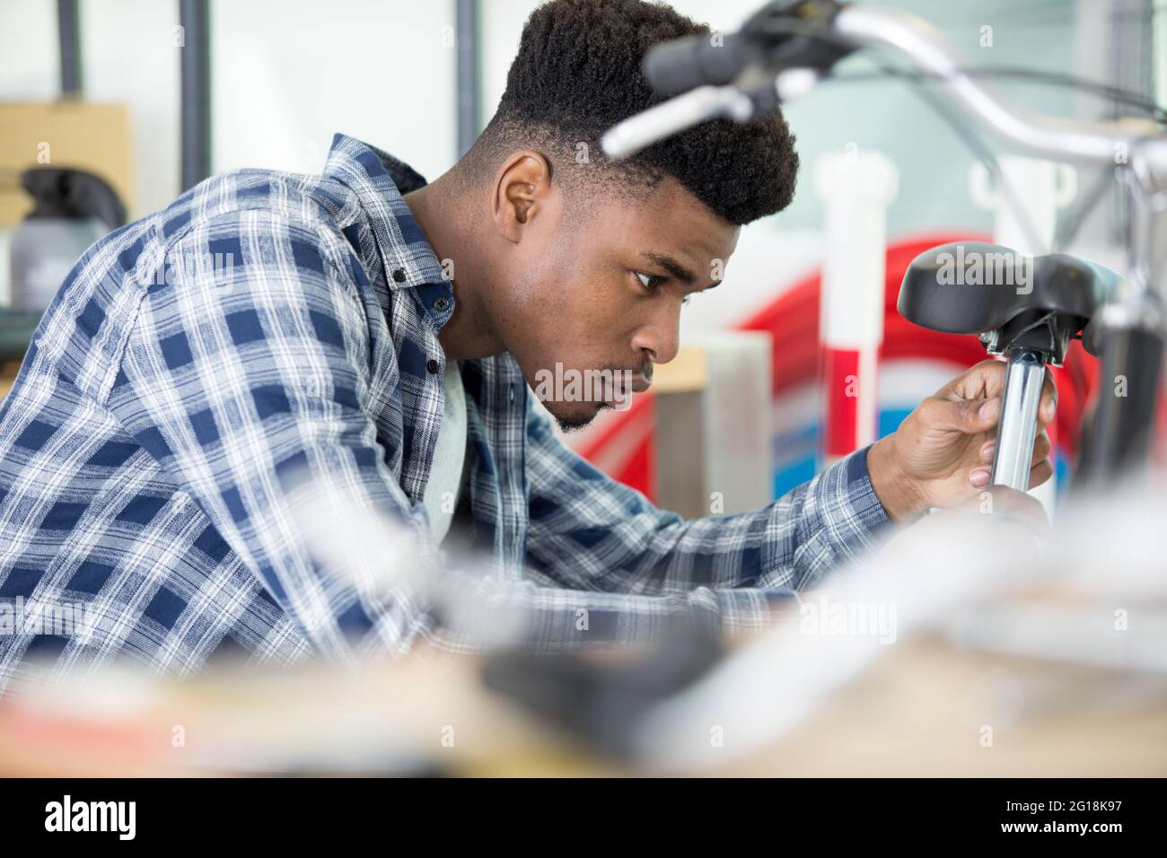 man fixing a bike Stock Photo - Alamy