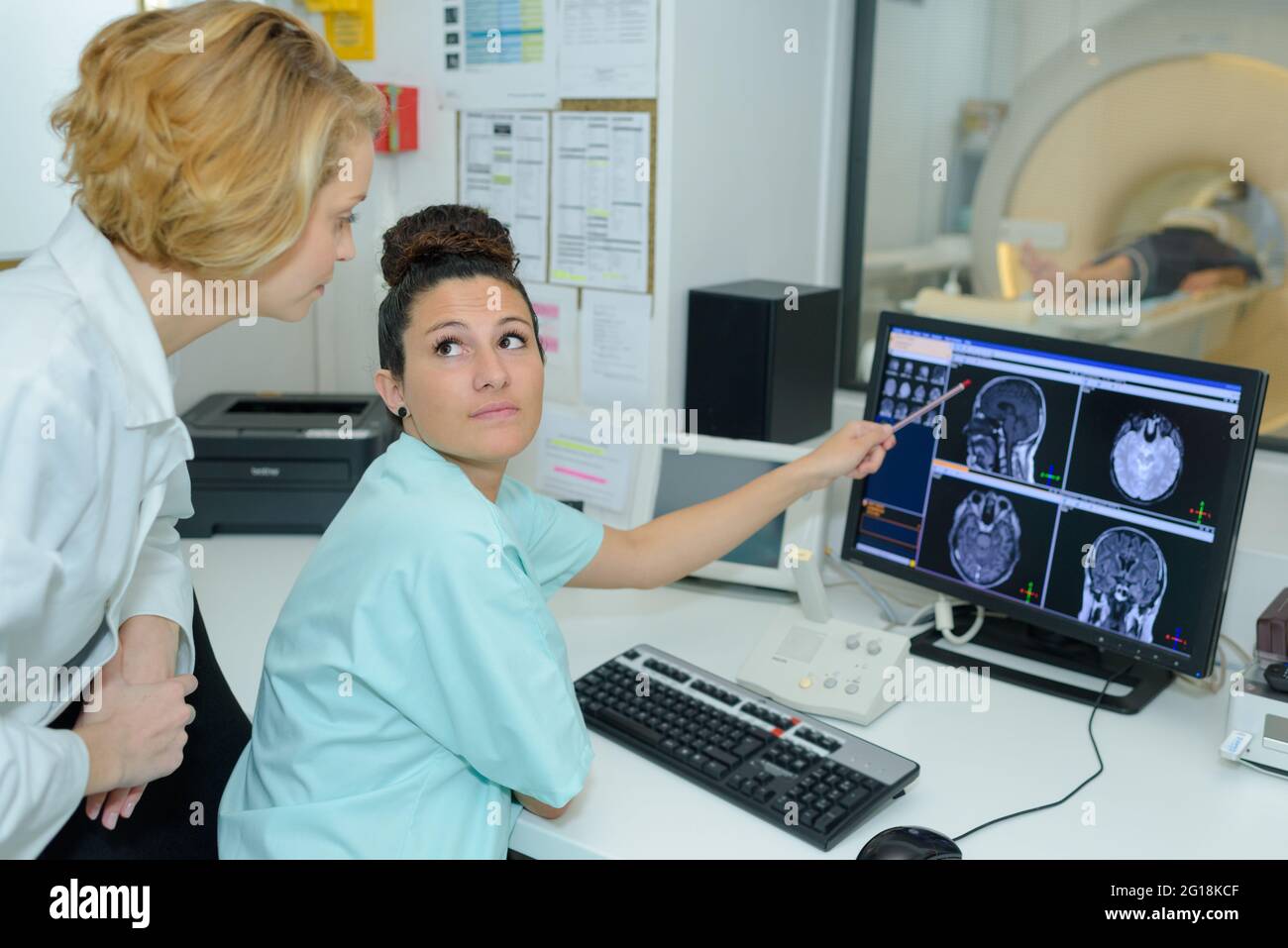 nurse pointing at computer screen Stock Photo - Alamy