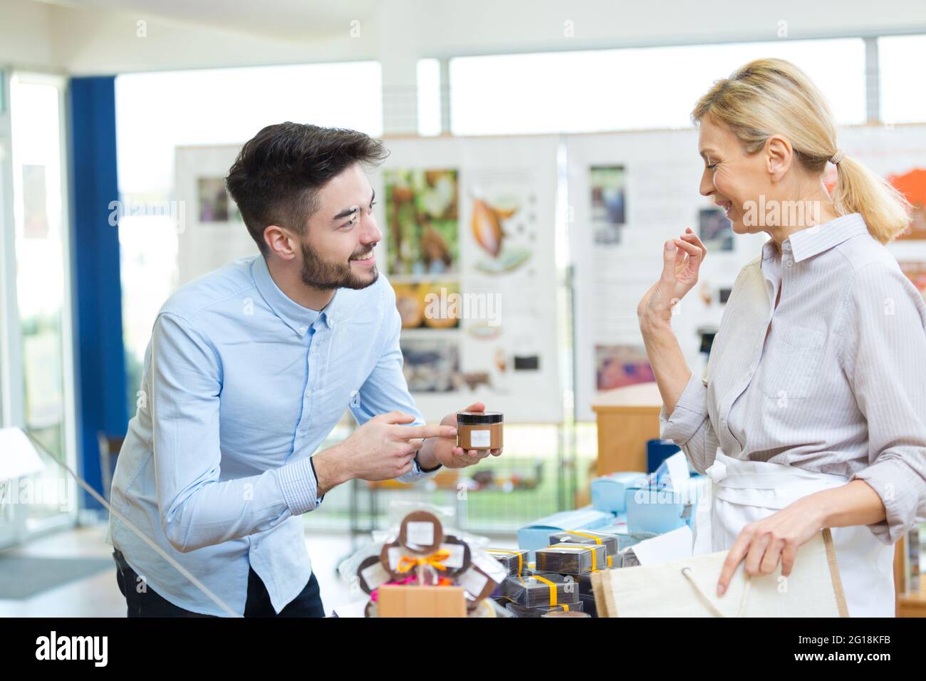 customer inspecting an organic cocoa product Stock Photo - Alamy