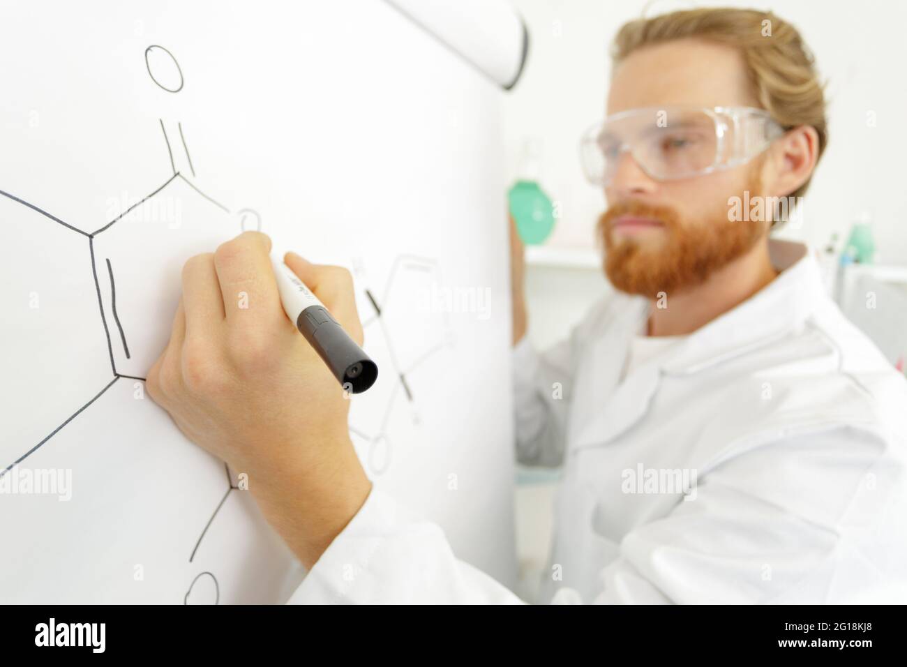 a male student mathematician in front of chalkboard Stock Photo - Alamy