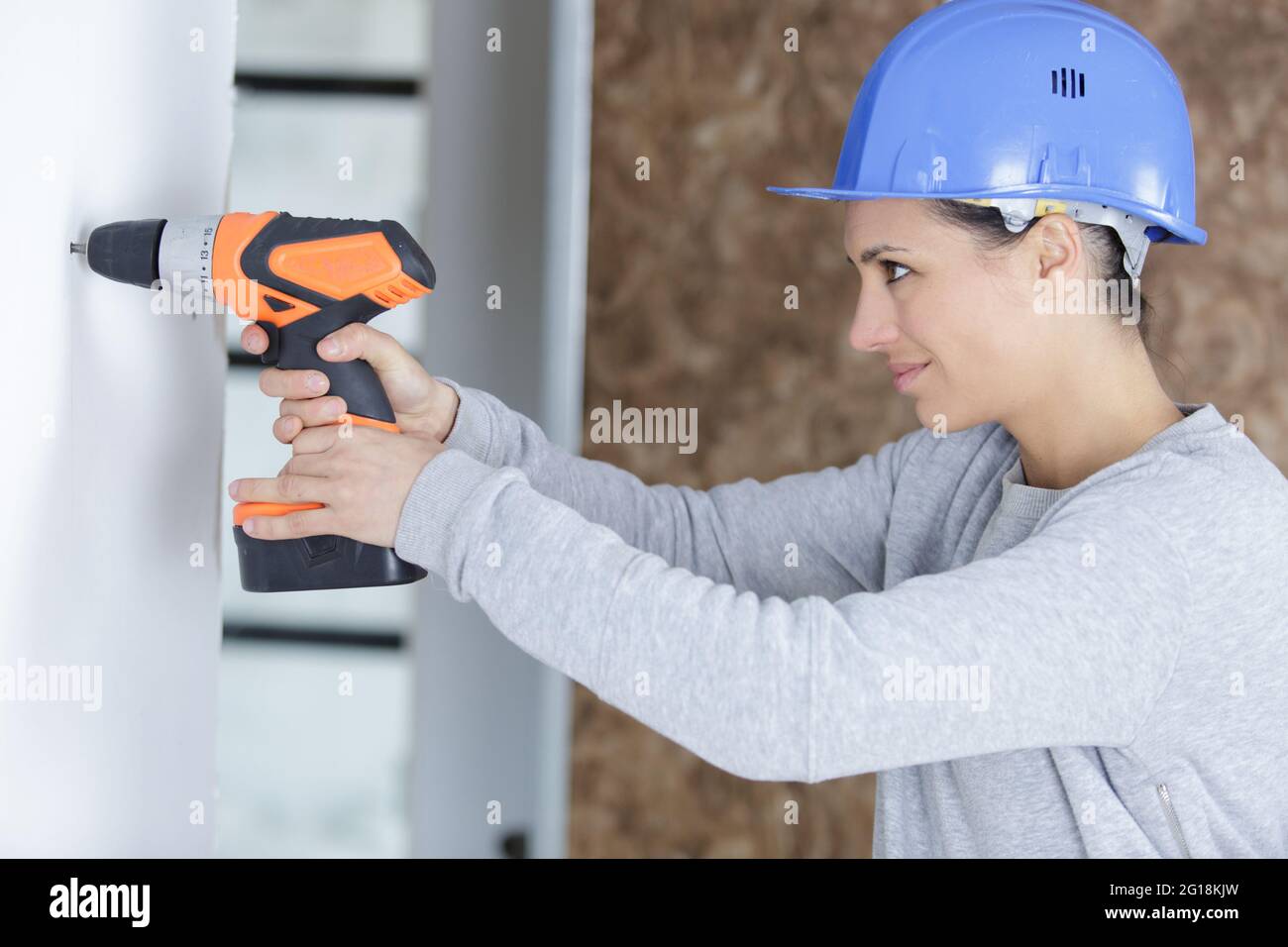 happy woman with a drill Stock Photo - Alamy