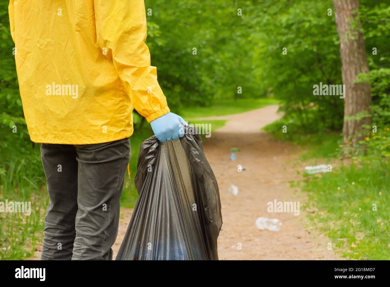 Volunteer clean up trash a park background. Ecology pollution plastic ...