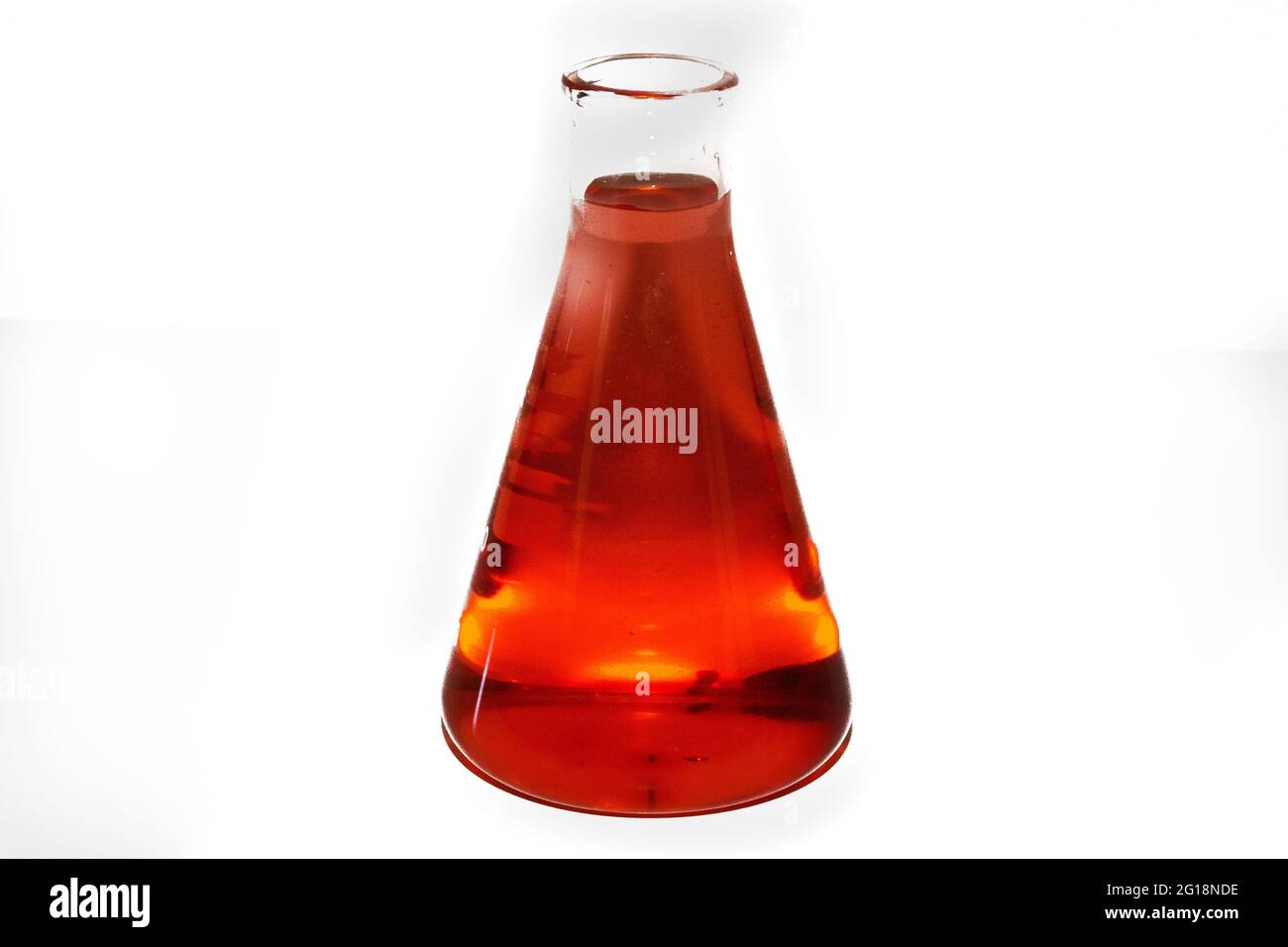 The color liquid in a glass beaker on a white background Chemistry ...