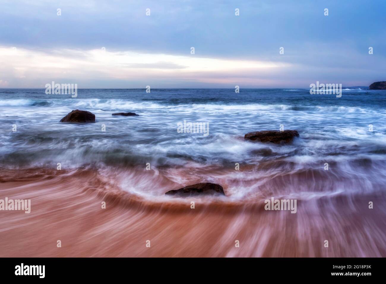 Rock stones off Mona Vale beach in high tide surf at sunrise - Sydney ...