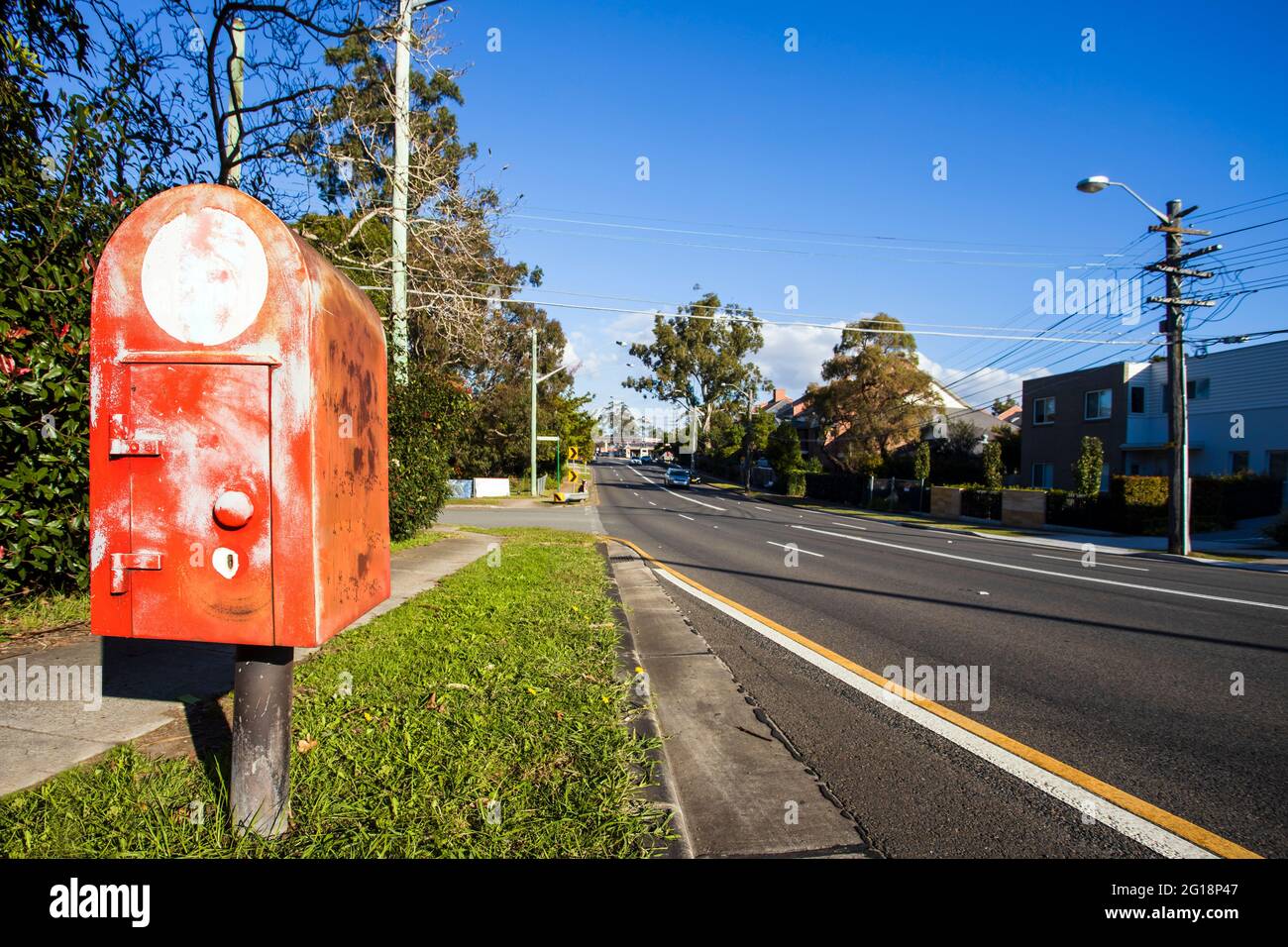 Rustic old red postal and letter box on street of Greater Sydney ...