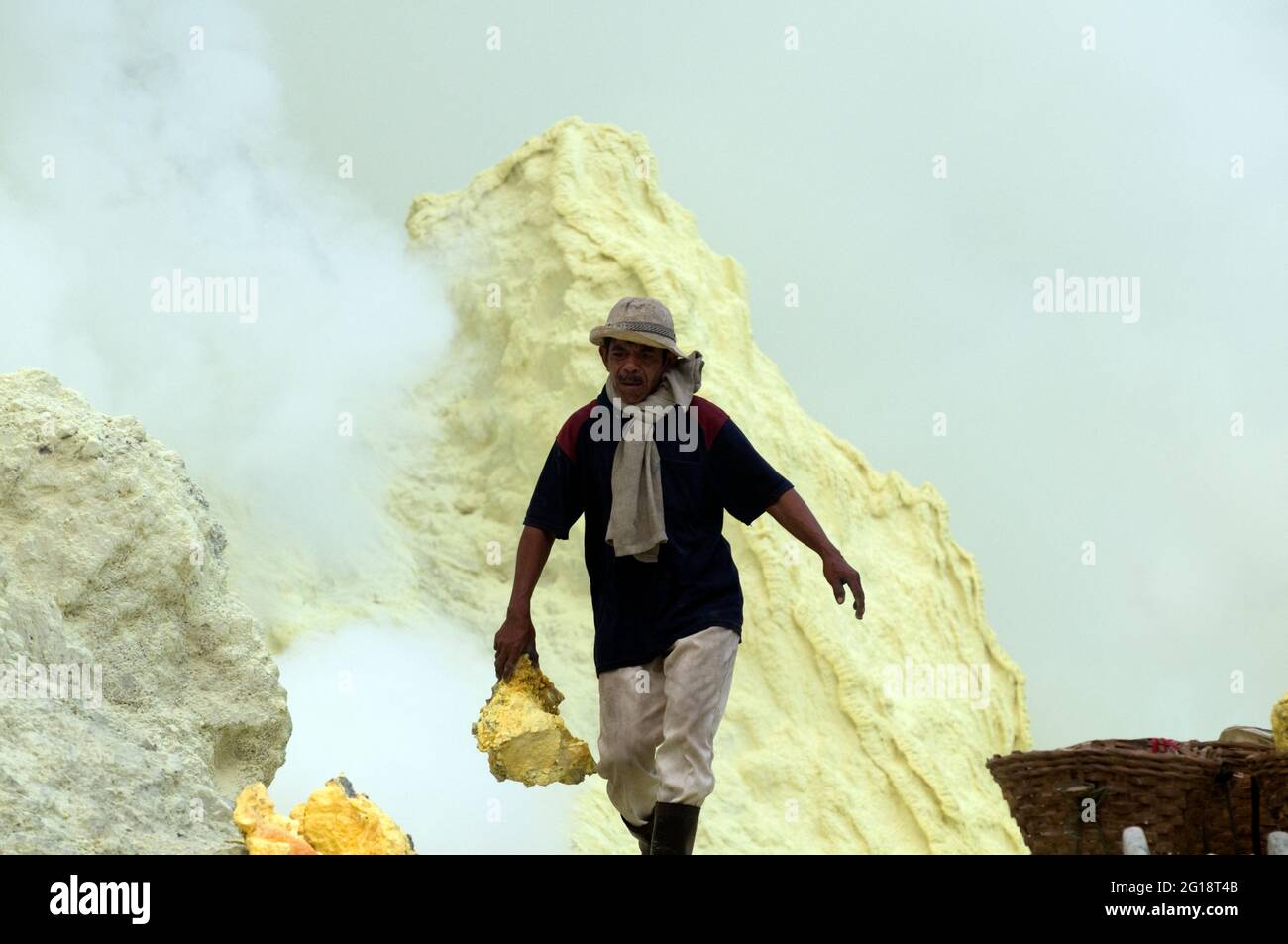 A miner inside Kawah Ijen volcano Stock Photo - Alamy