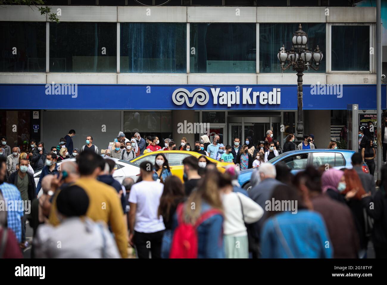People wearing facemasks as a precaution against the spread of covid-19 seen at Yap? Kredi Bank ...