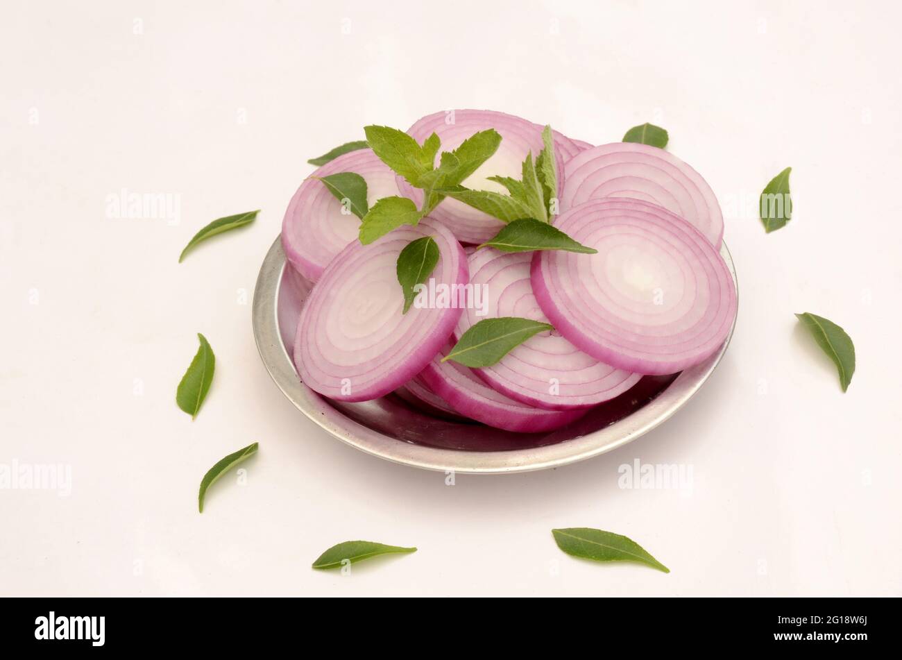 closeup sliced onion in the plate isolated on white background Stock ...