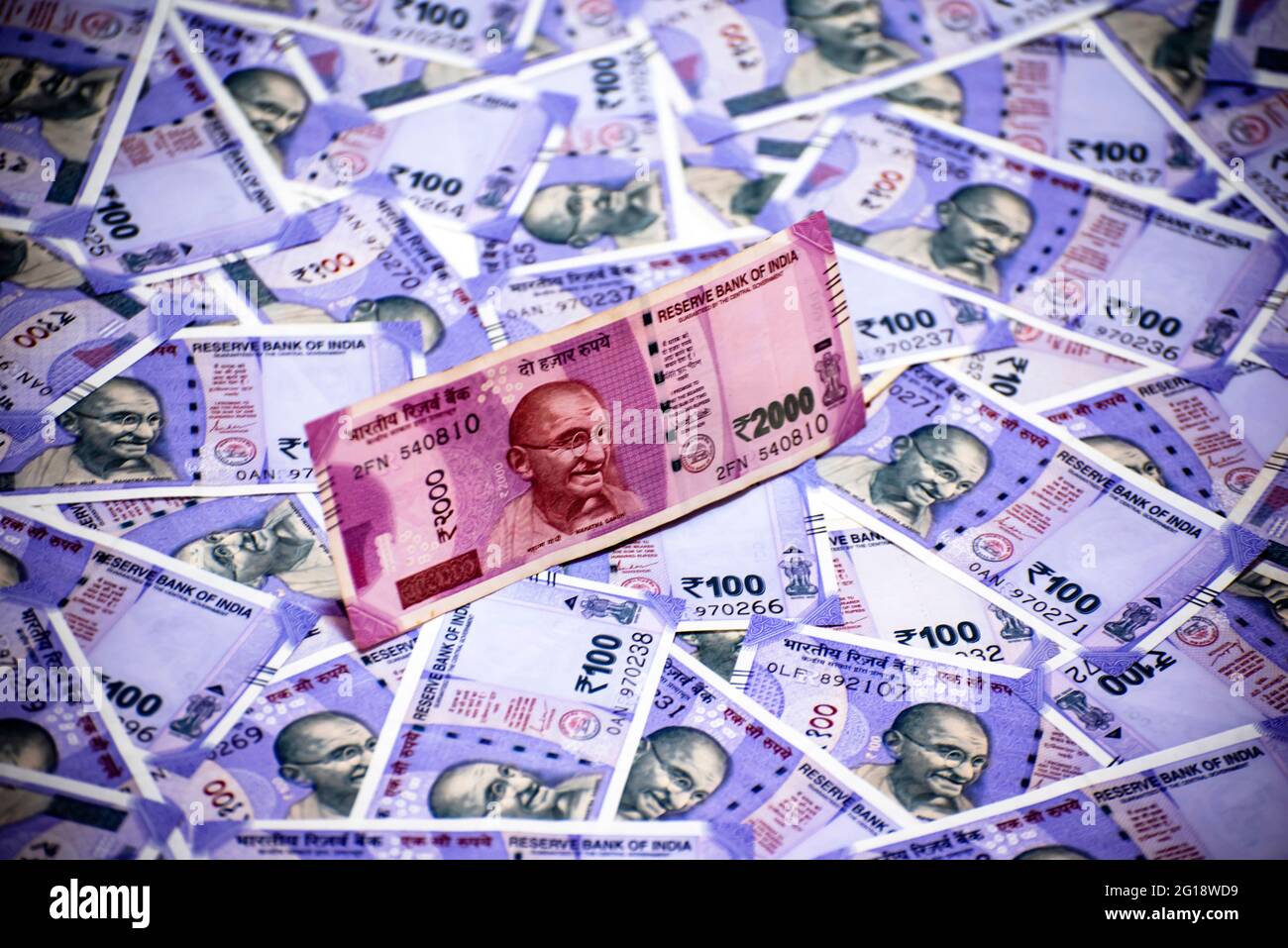 Two Thousands Rupees Note On Indian One Hundreds Rupees Notes