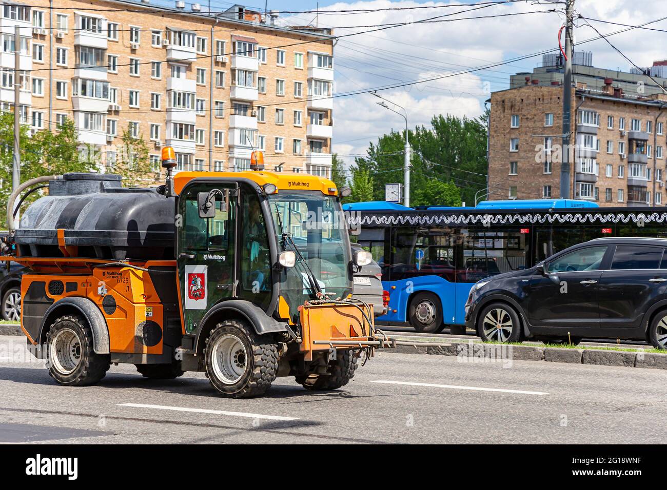 Sweeper machine on the road in the city (street sweeper). Community ...