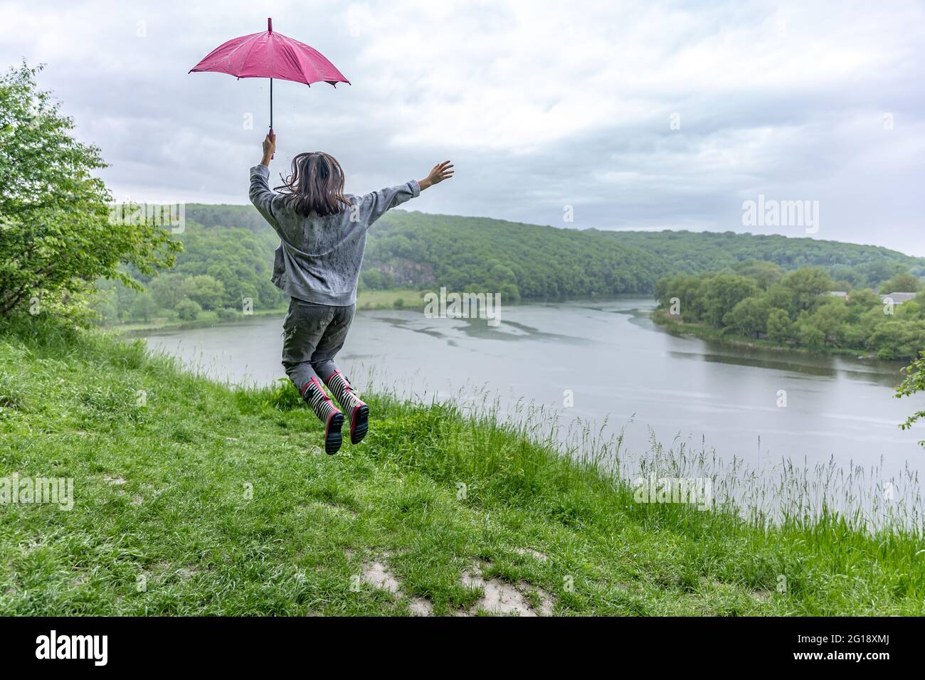 Girl jumping in river hi-res stock photography and images - Alamy
