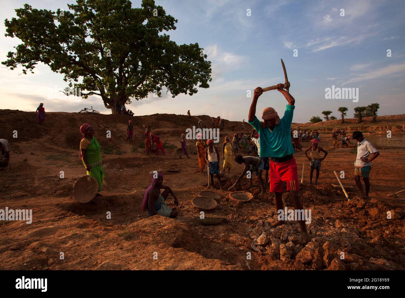 Daily labours are working to dig a pond and carrying soil Stock Photo ...