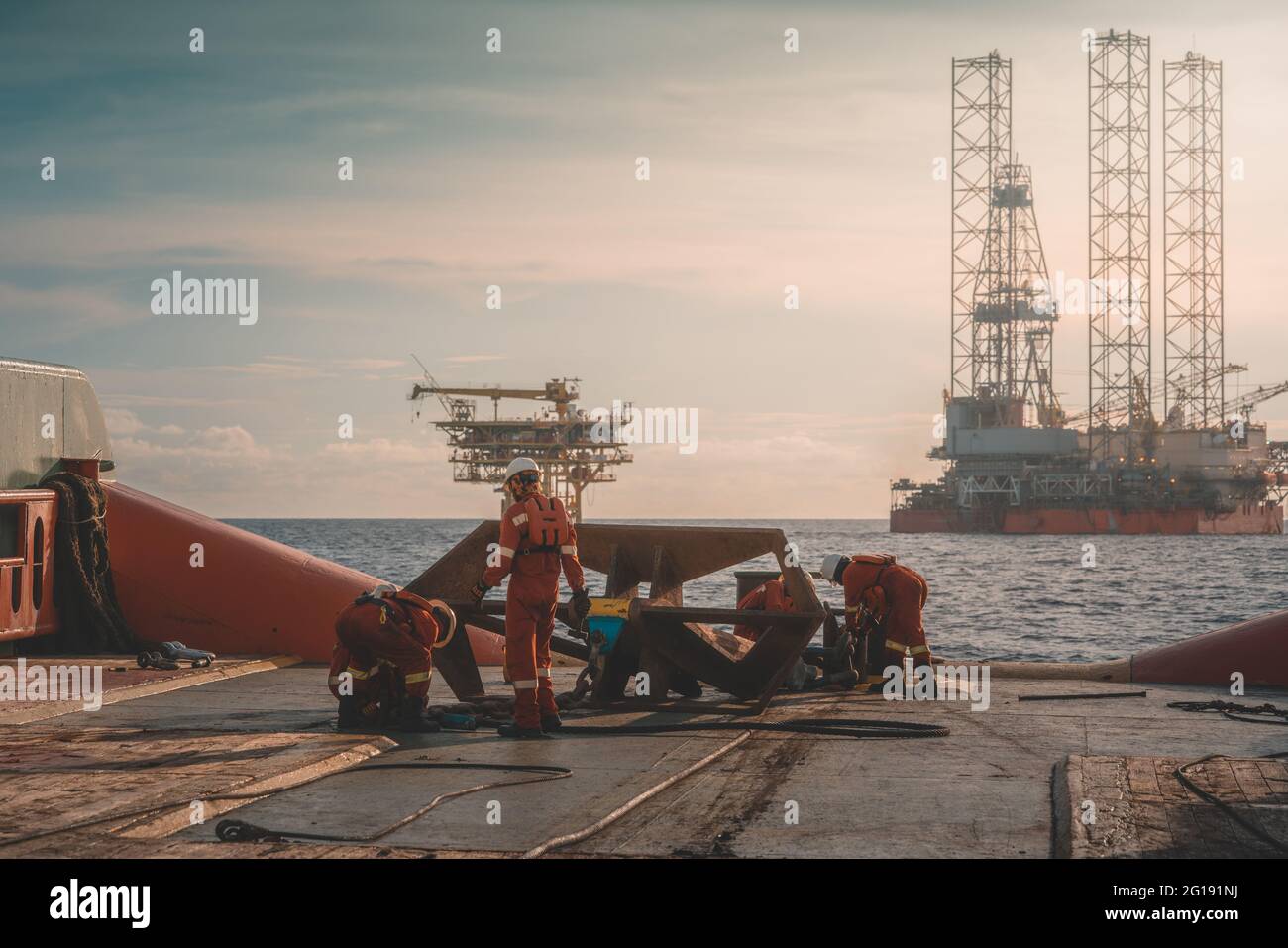 Offshore worker involvement in anchor handling operation Stock Photo ...