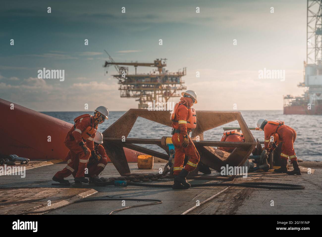 Offshore worker involvement in anchor handling operation Stock Photo ...
