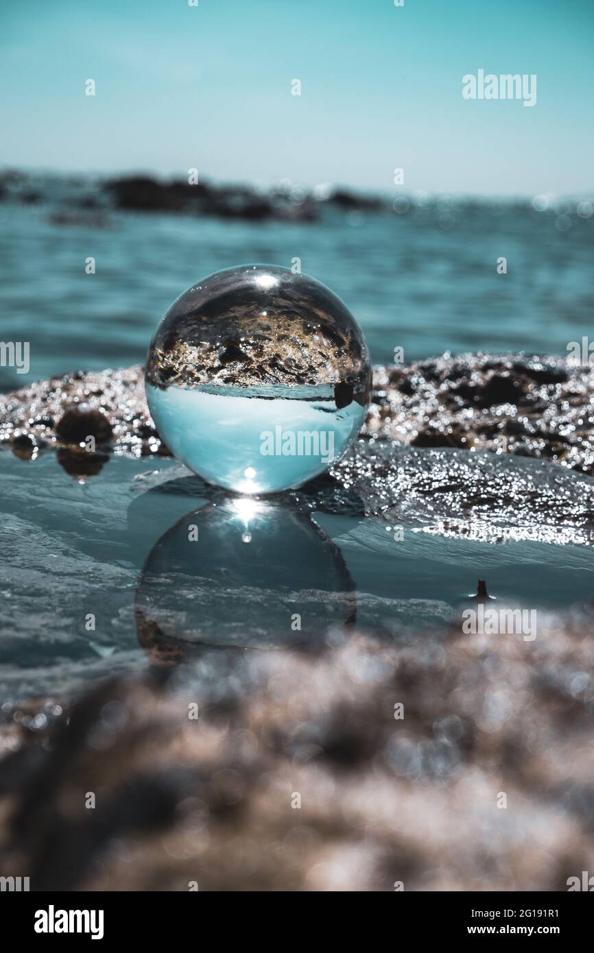 Photography of a glass ball resting against natural environments to ...