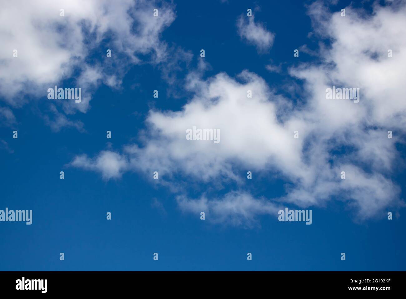 Beautiful sky background. Oddly shaped clouds in a blue sky Stock Photo - Alamy
