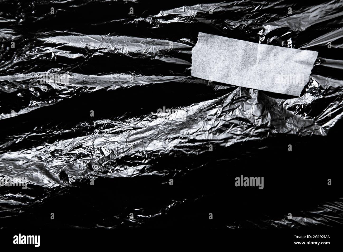 Photo of the polyethylene surface with white tape on black background ...