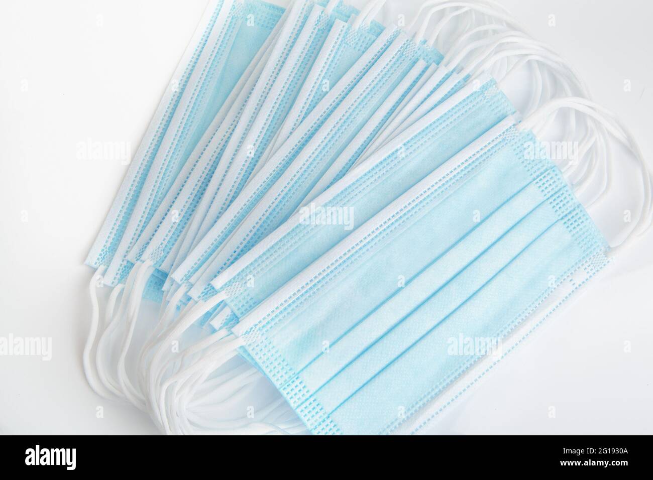 Studio shot of light blue Medical Face Masks Stock Photo - Alamy
