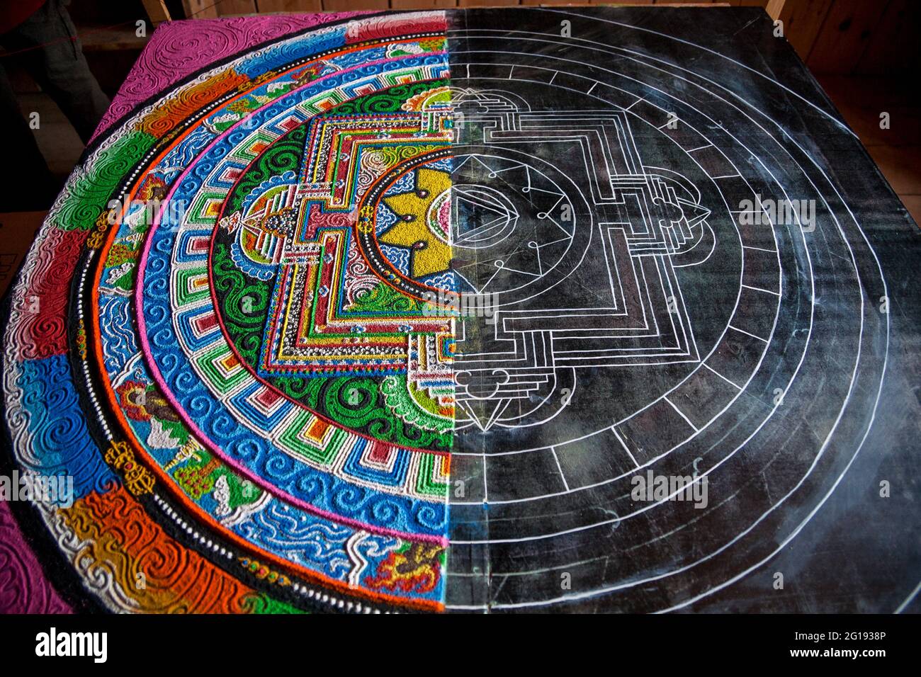 A sand mandala in construction at Tsechen Shedrubling Monastic School ...