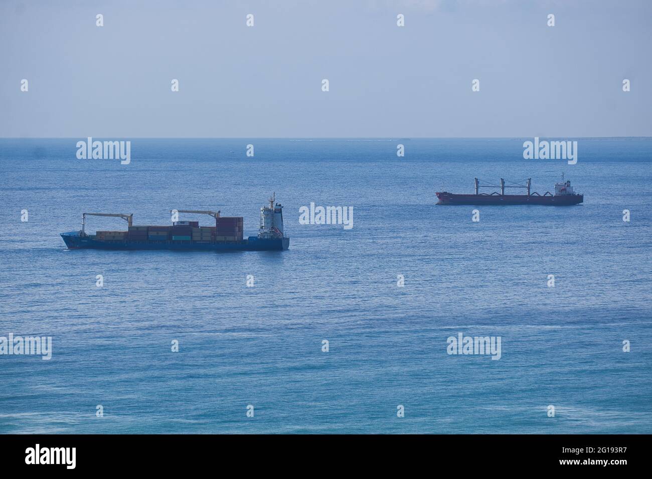 freight ship setting sail from the port. view Stock Photo - Alamy