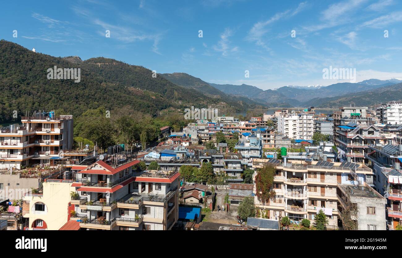 Cityscape of Pokhara with the Annapurna mountain range covered in snow ...