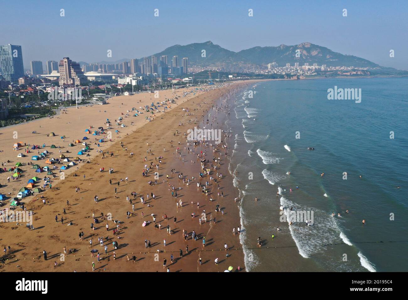 QINGDAO, CHINA - JUNE 5, 2021 - Tourists flock to the Shilaolang ...