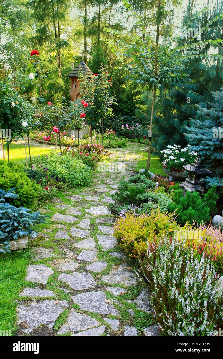 Path in the garden. Summer time Stock Photo - Alamy