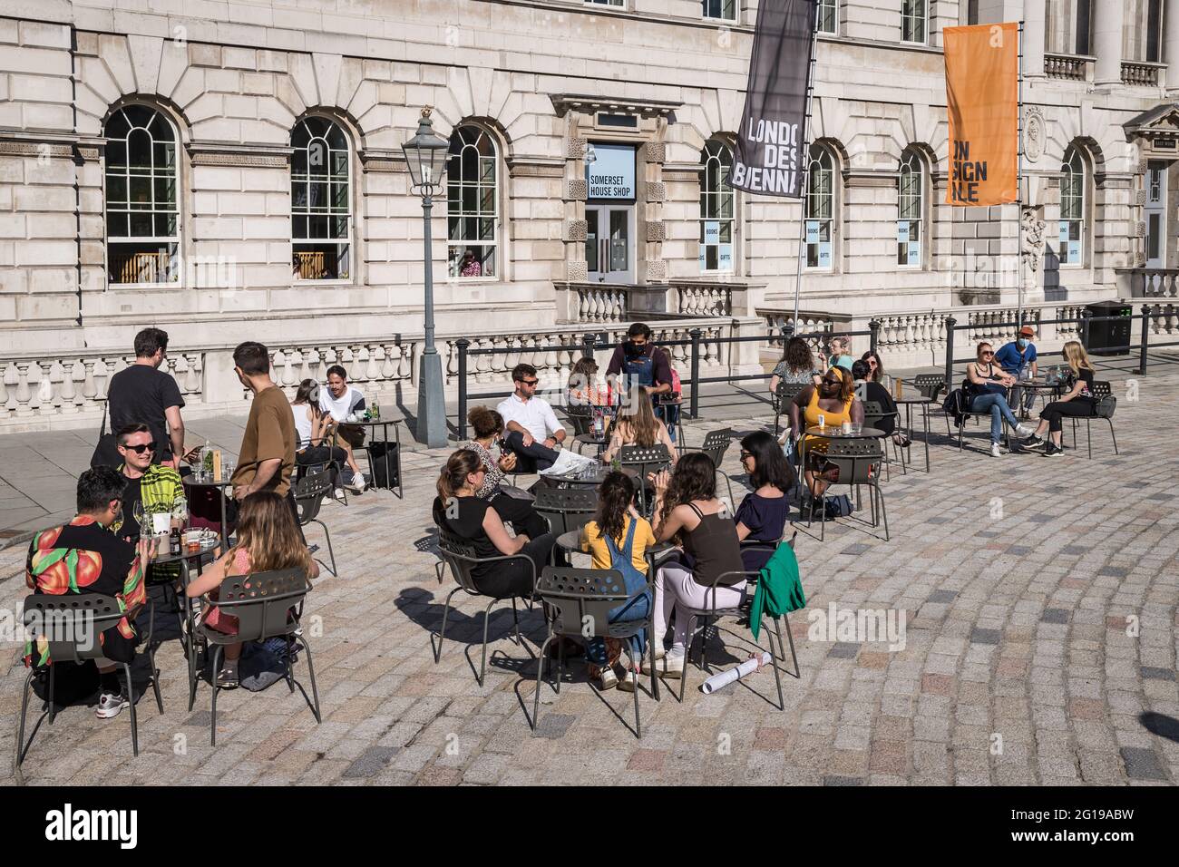 Visitors enjoying a drink in the courtyard of Somerset House, London ...