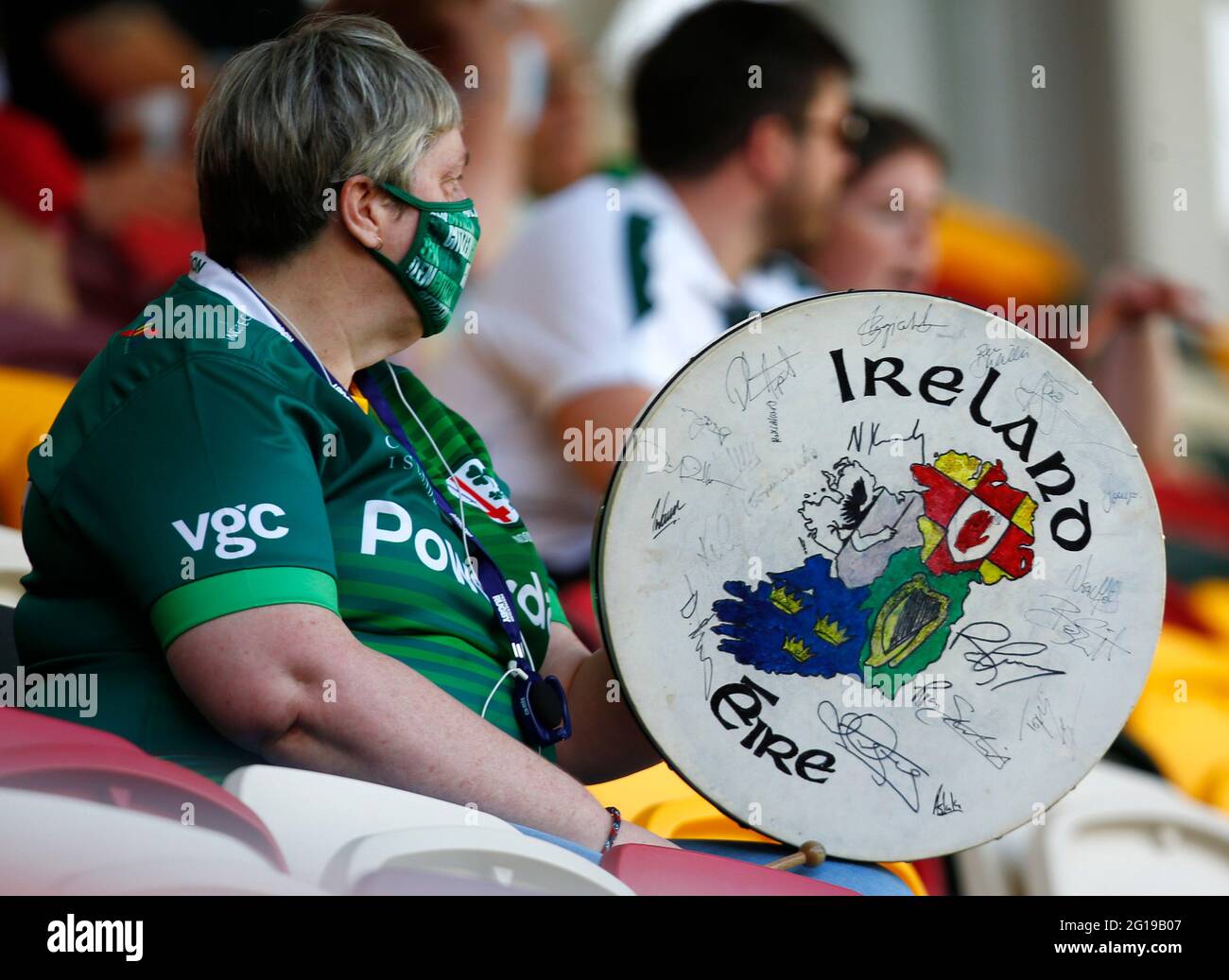 BRENTFORD, ENGLAND - JUNE 05: London Irish fan playing the drum ahead ...