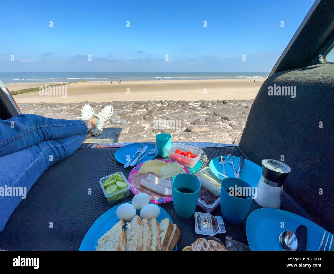 A car parked on a beach. Picnic on the beach in the boot Stock Photo ...