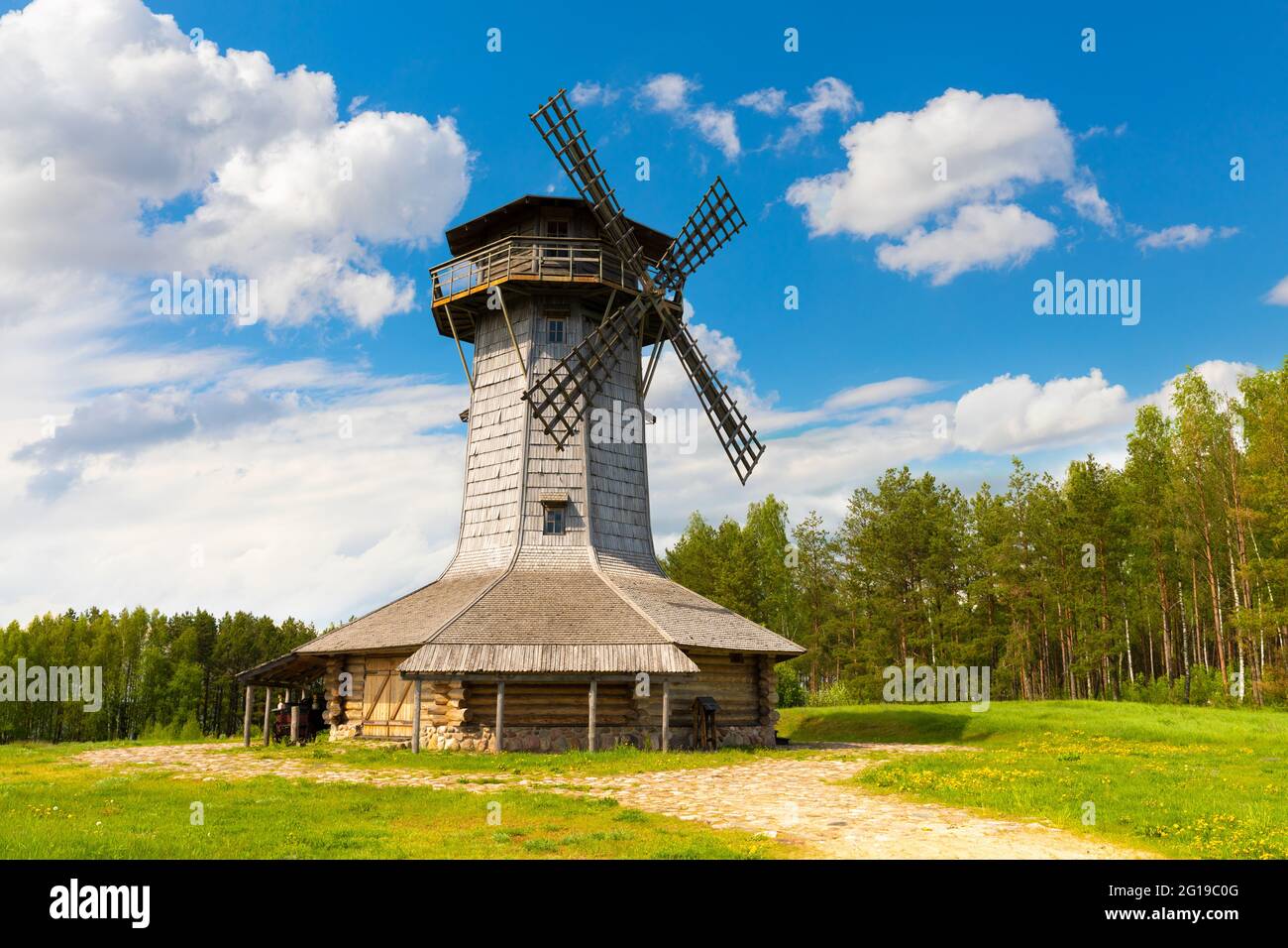 Wooden windmill on background sky with clouds. Naroch lake, Myadel ...