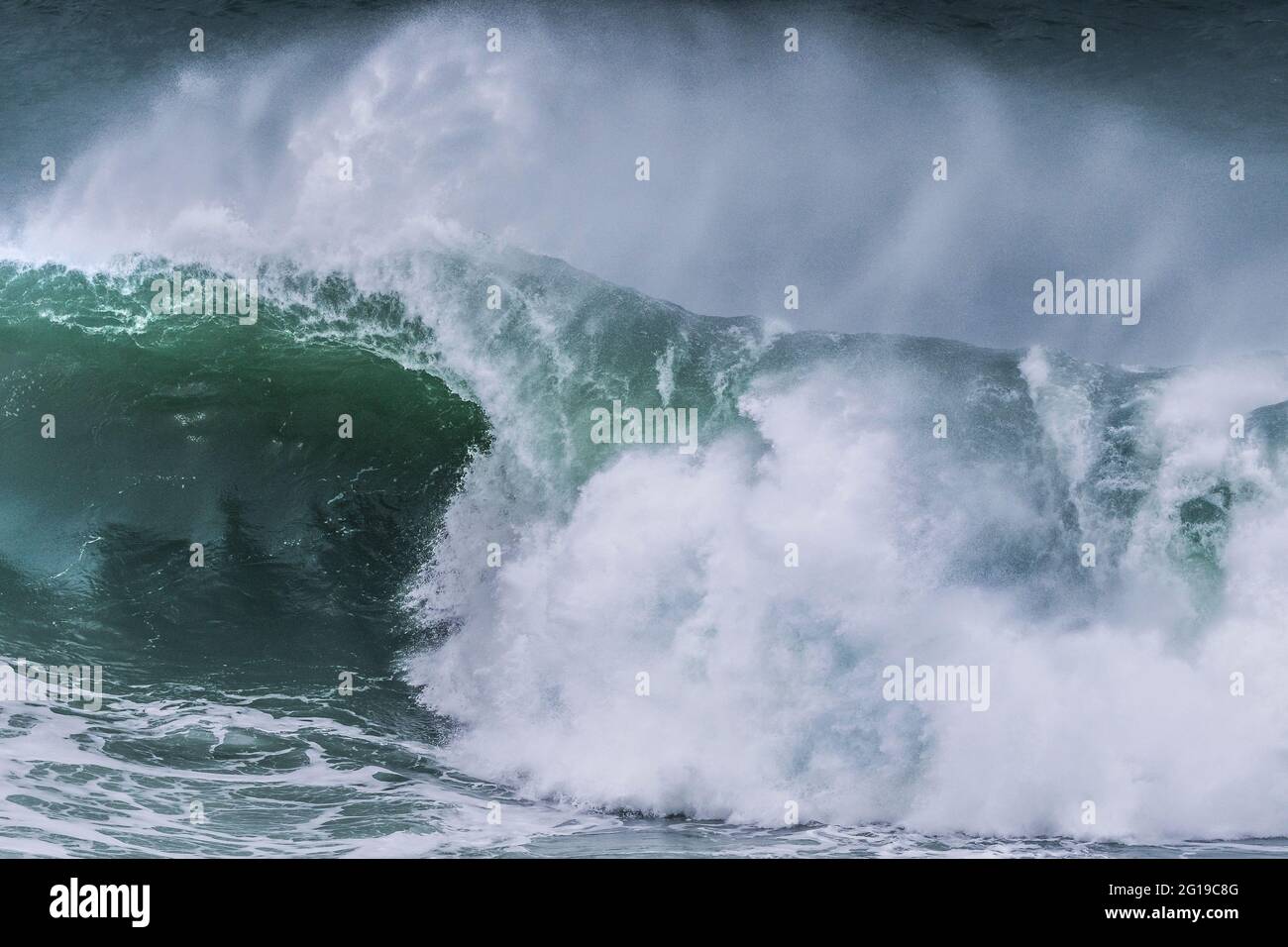 A wild wave breaking on the Cribbar Reef off Towan Head in Newquay in ...
