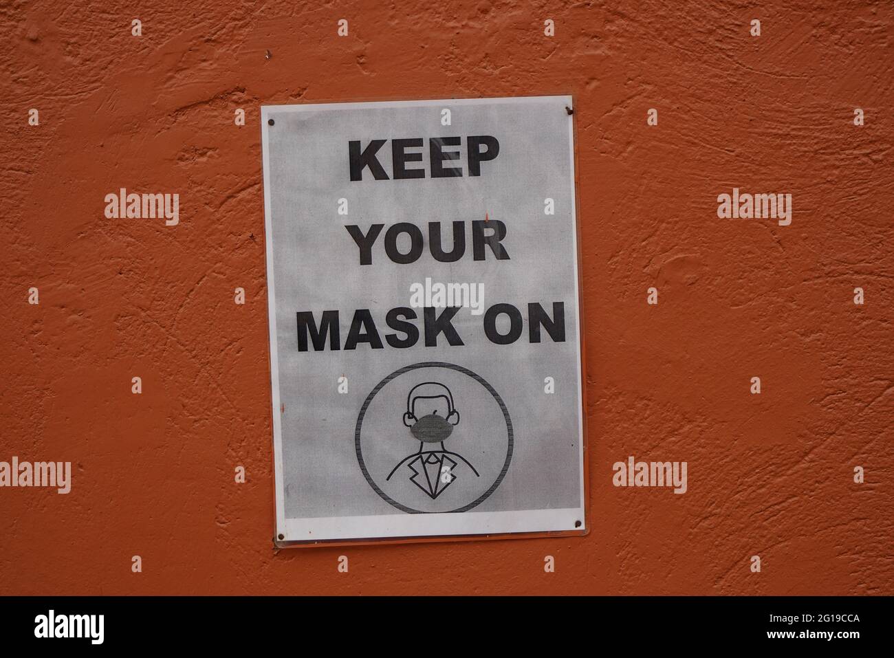 Signboard with Keep Your Mask On Stock Photo - Alamy