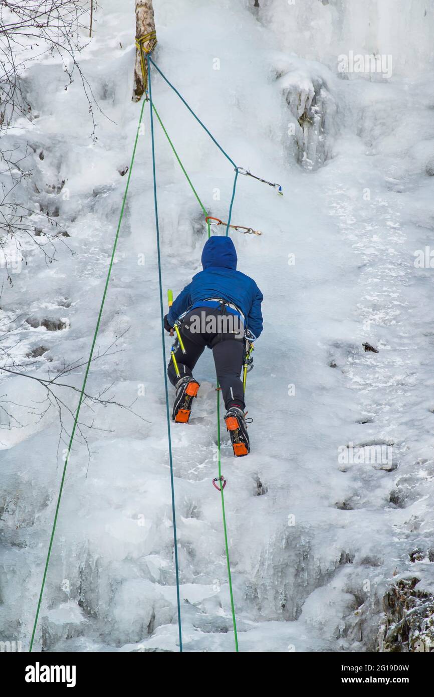 Climbing on frozen ice in Poland Stock Photo - Alamy