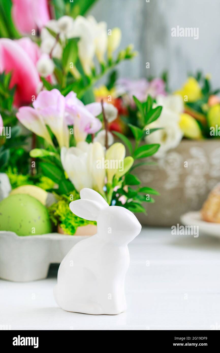 Ceramic rabbit figure on Easter table. Festive decor Stock Photo - Alamy