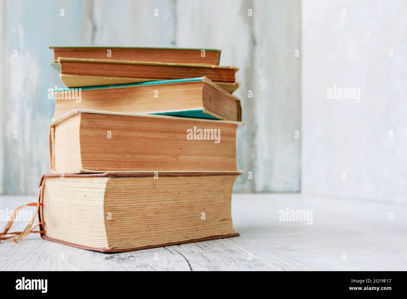 Old books on wood table hi-res stock photography and images - Alamy