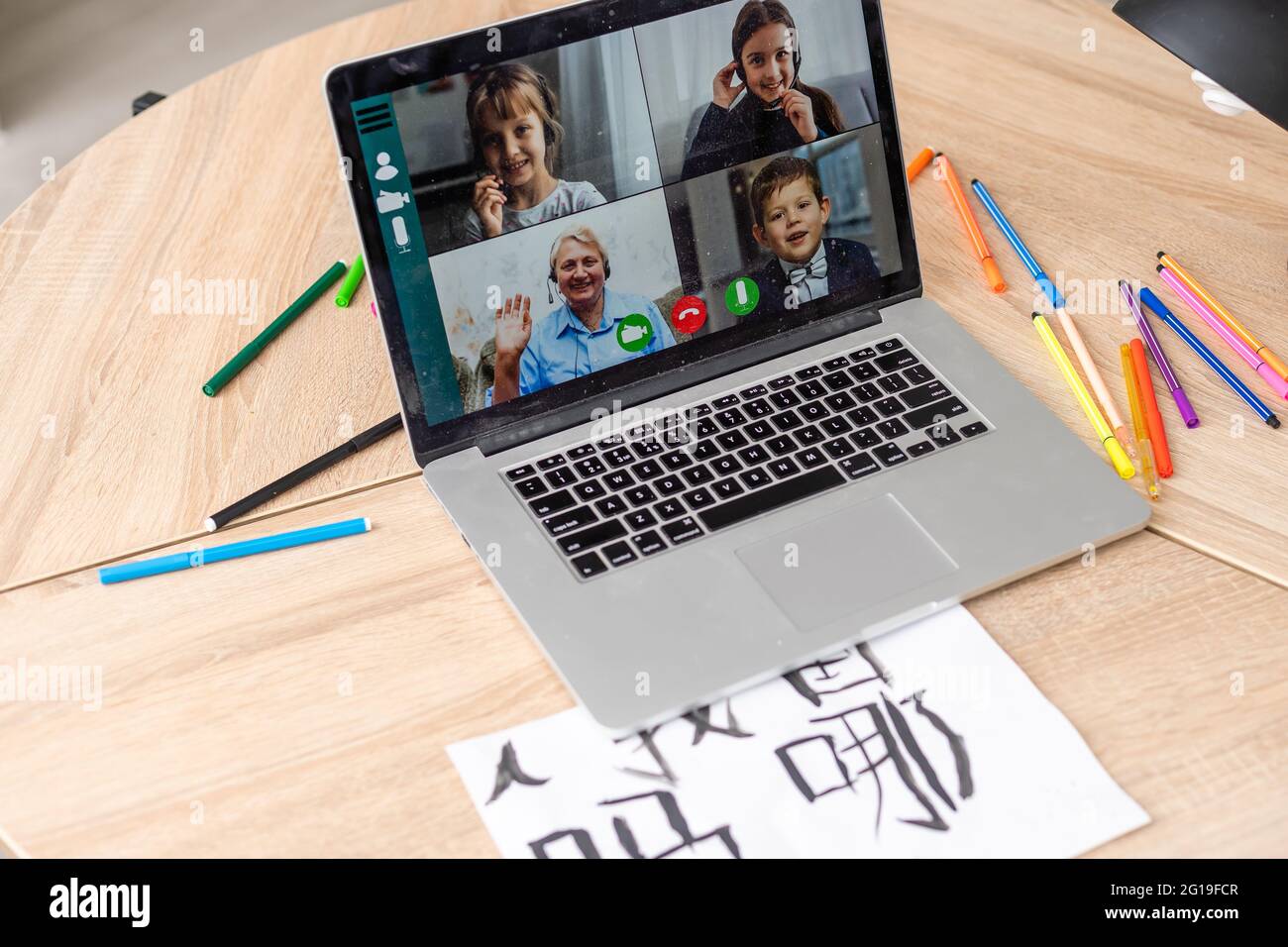 Online remote learning. School kids with computer having video ...