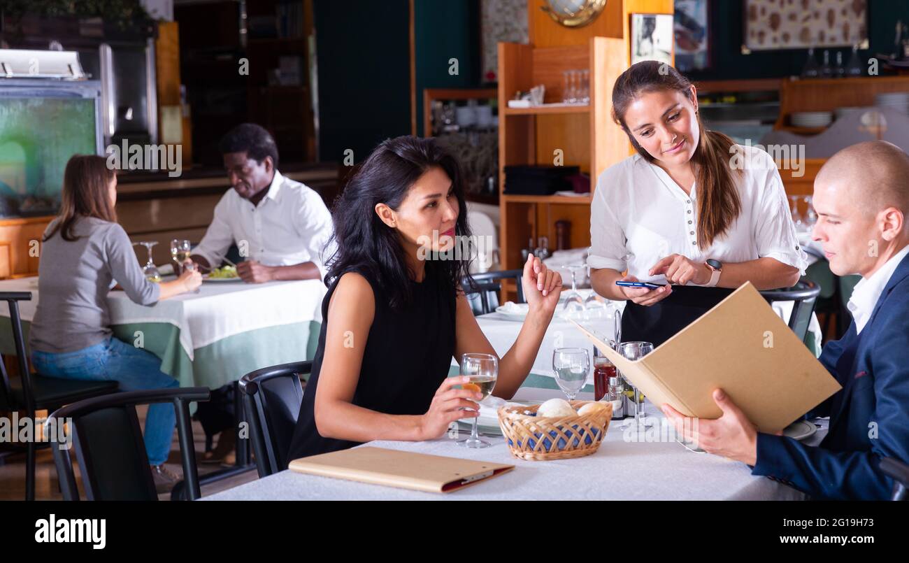 Asian male waiter taking order hi-res stock photography and images - Alamy