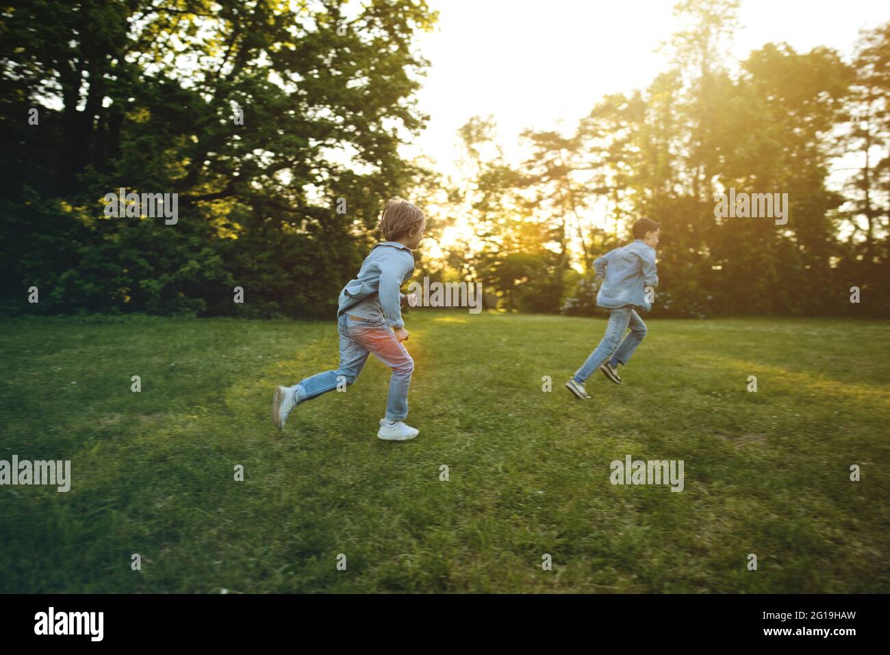 Two boys running forest hi-res stock photography and images - Alamy