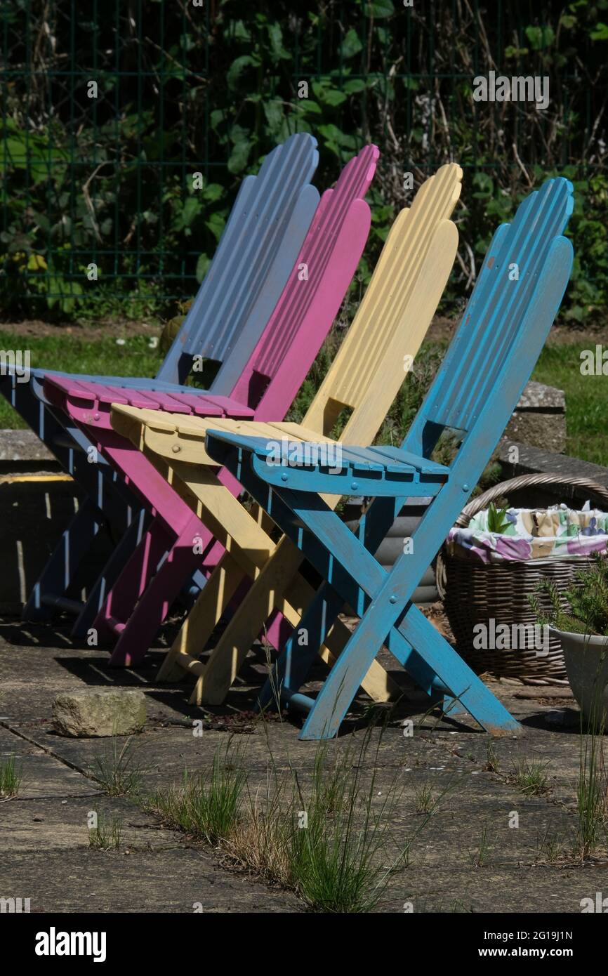 colourful wooden garden chairs Stock Photo - Alamy