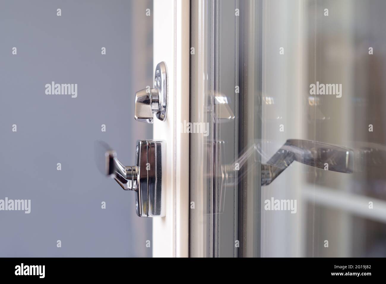 window door with chrome handle and latch Stock Photo - Alamy