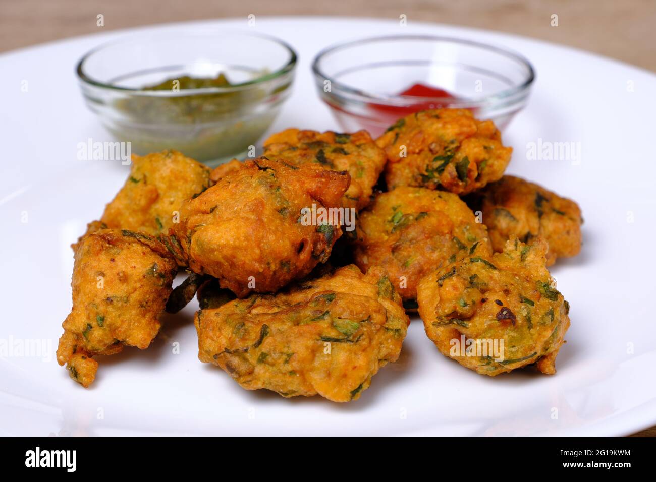 Indian snack pakora with tomato sauce or chutney Stock Photo - Alamy